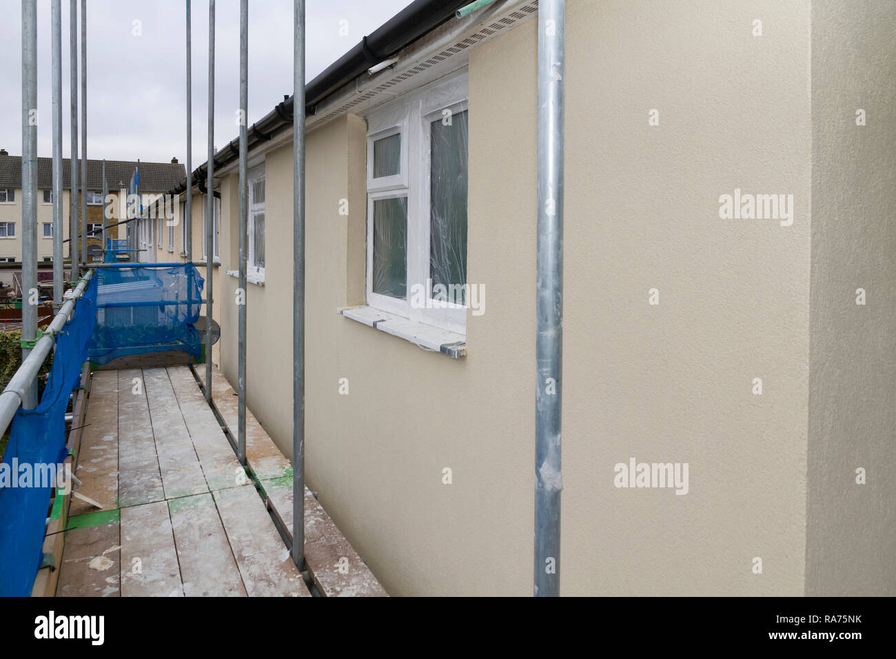 Self Coloured house rendering and Insulation of Stock Photo - Alamy