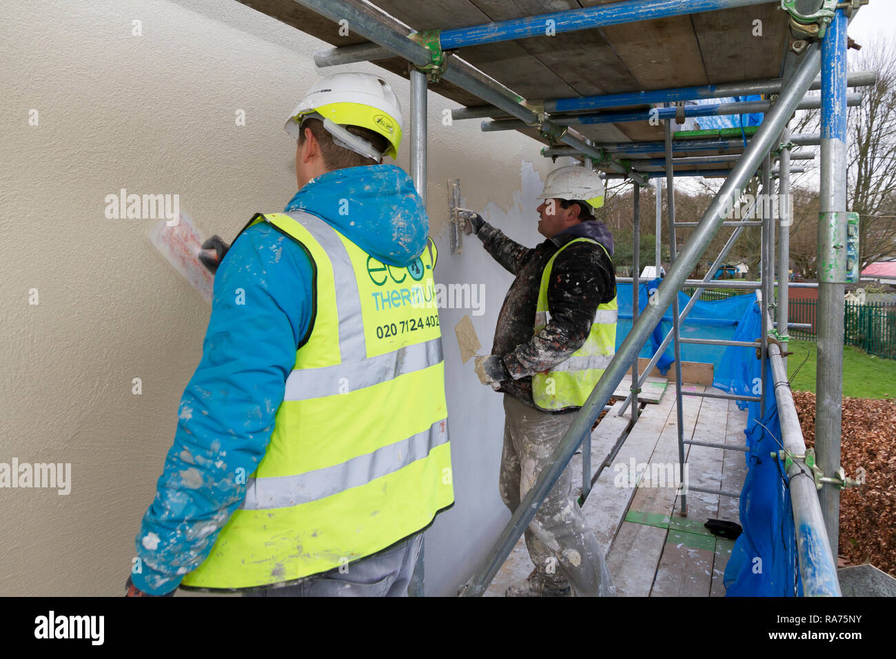 Self Coloured house rendering and Insulation of Stock Photo - Alamy