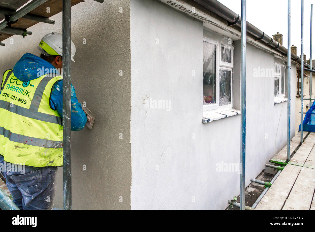 Self Coloured house rendering and Insulation of Stock Photo - Alamy