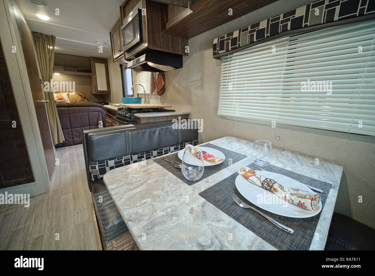Set table inside RV travel trailer. Dining table in RV camper Stock ...