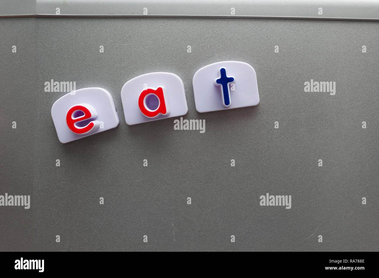 Word "eat" written of fridge, magnets, concept obesity Stock Photo - Alamy
