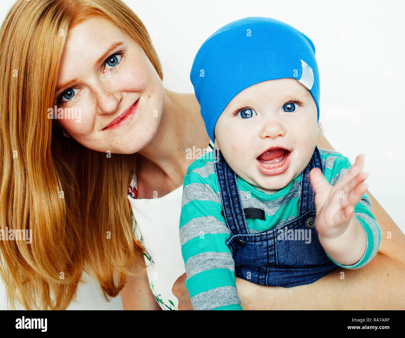 young beauty mother with cute baby, red head happy modern family Stock ...