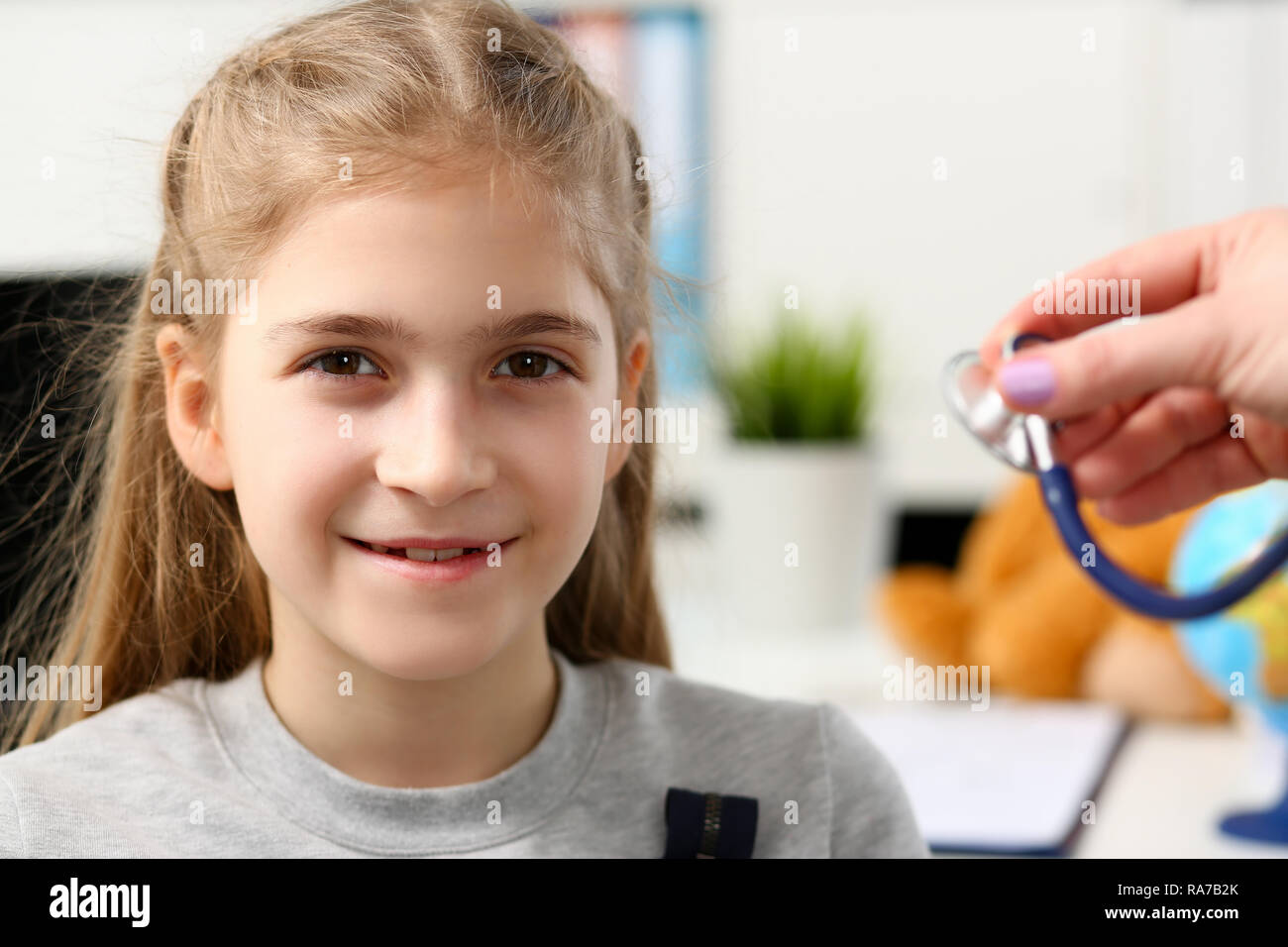 Little child at pediatrician reception Stock Photo - Alamy
