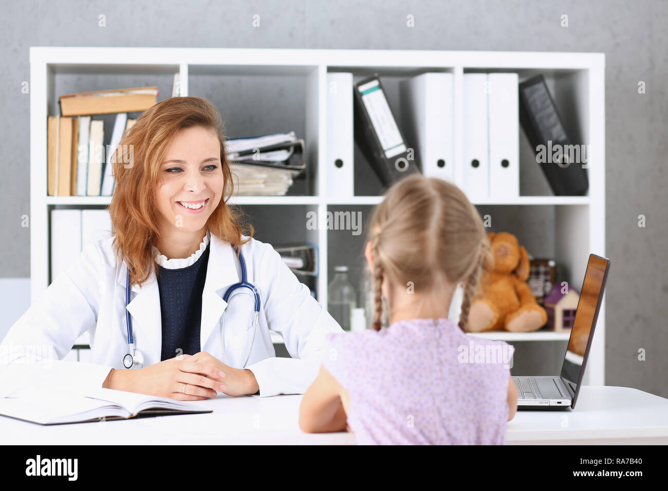 Little child at pediatrician reception Stock Photo - Alamy