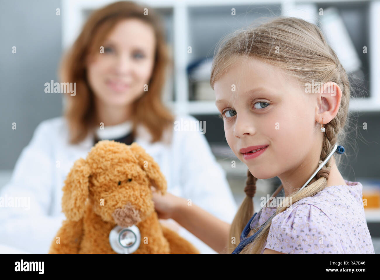Little child with stethoscope at doctor Stock Photo - Alamy