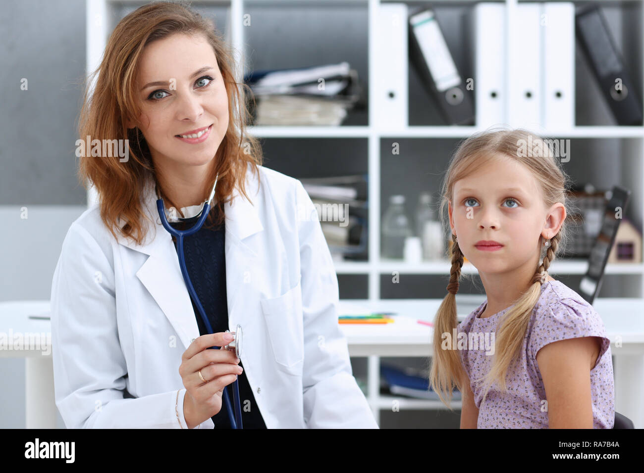 Little child at pediatrician reception Stock Photo - Alamy