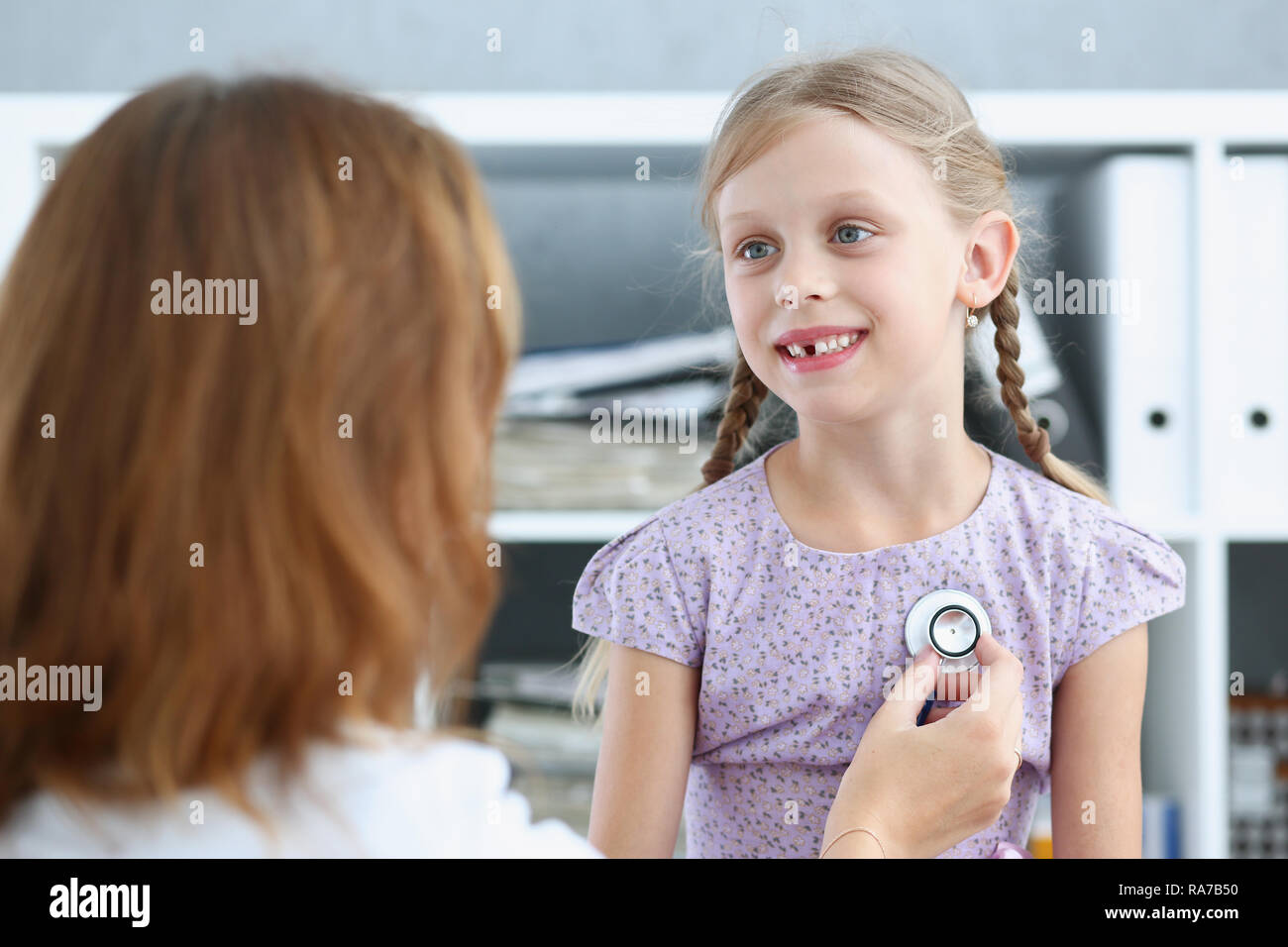 Little child at pediatrician reception Stock Photo - Alamy
