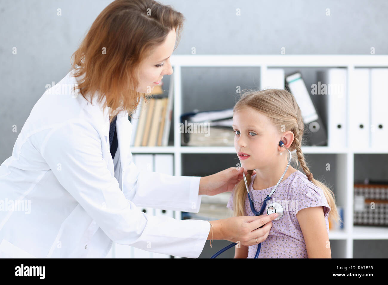 Little child at pediatrician reception Stock Photo - Alamy