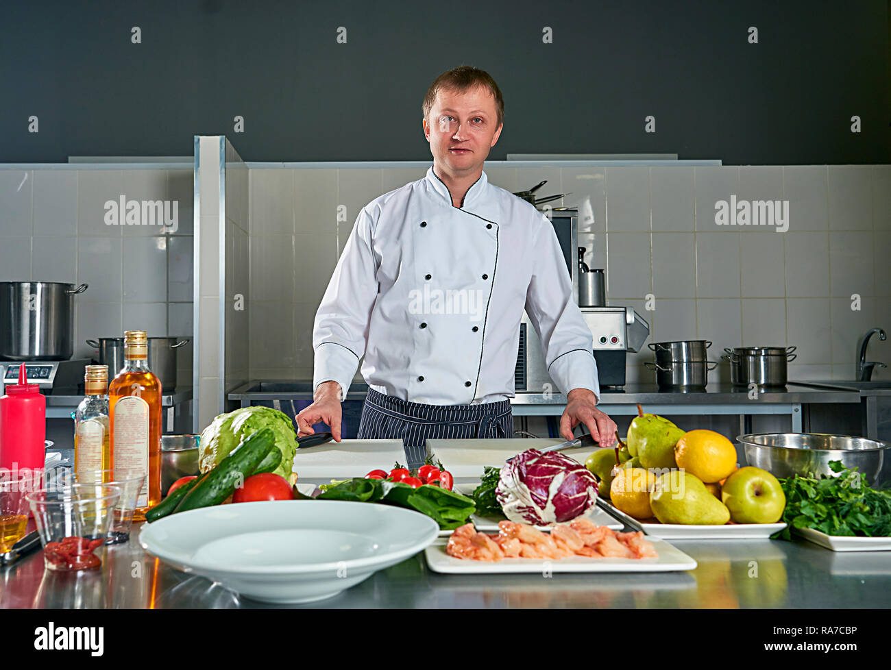 Chef standing and table hi-res stock photography and images - Alamy