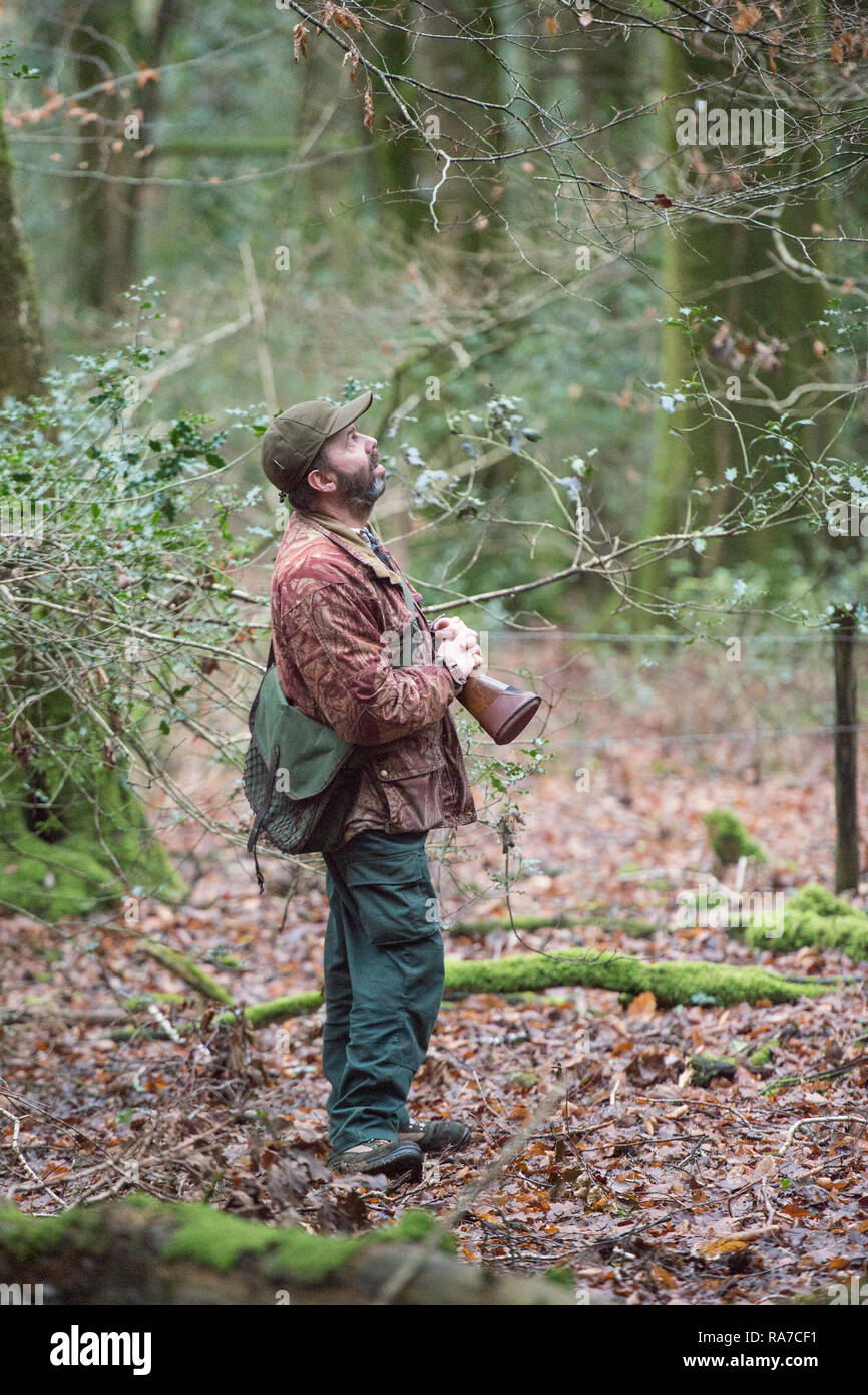 man shooting in woodland Stock Photo - Alamy