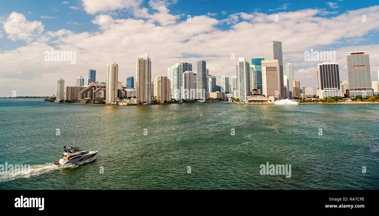 Miami skyline skyscrapers ,yacht or boat sailing next to Miami downtown ...