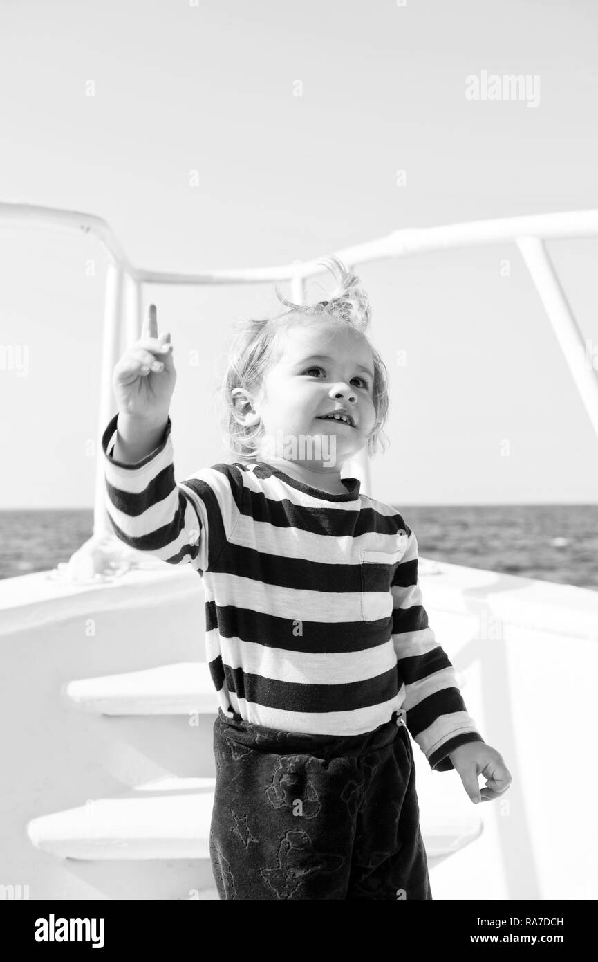 Boy concept. Sailor boy. Boy travel on ship in sea. Little boy keep ...