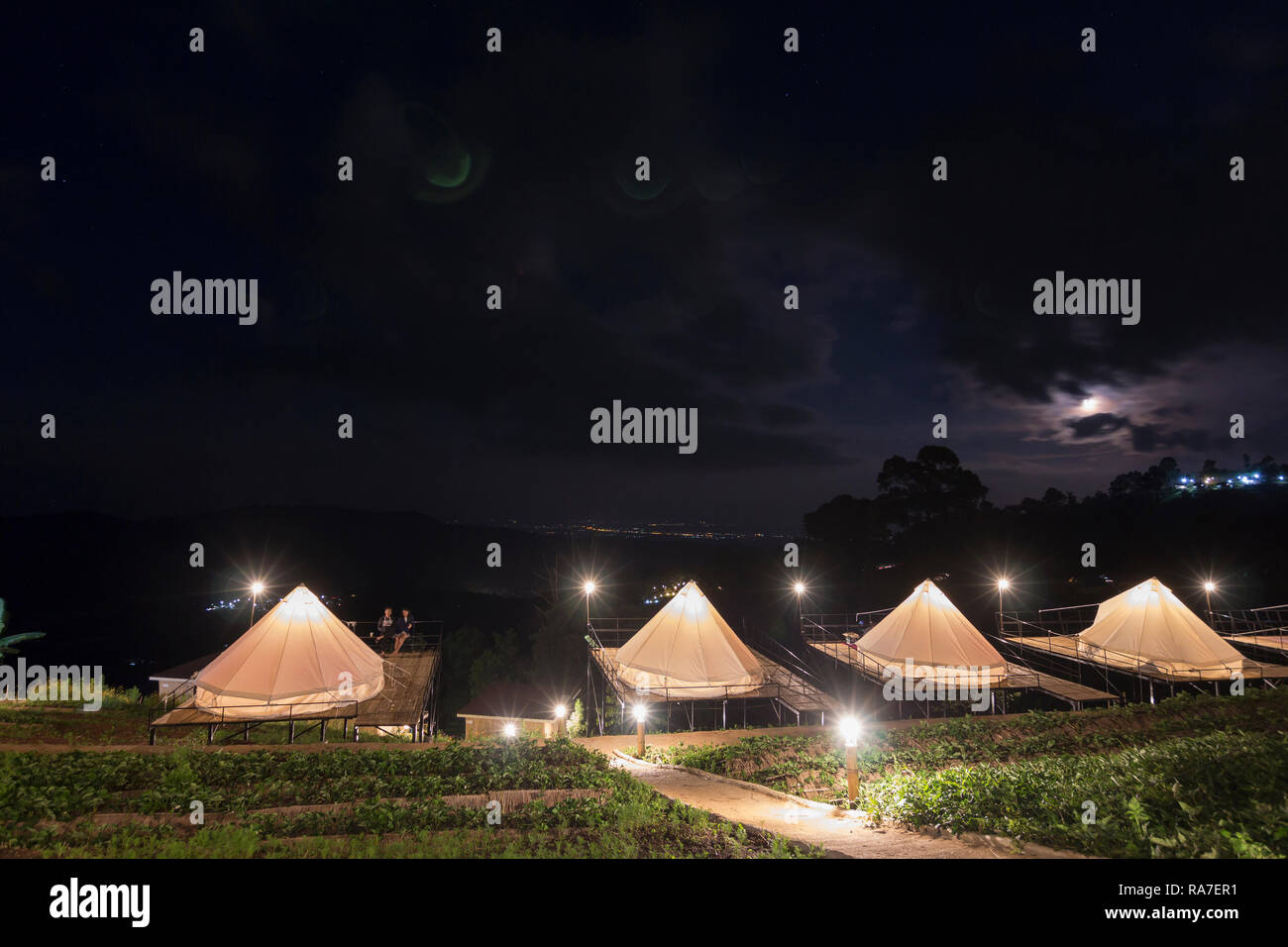 Camping tent under the moonlight and stars at night Stock Photo - Alamy