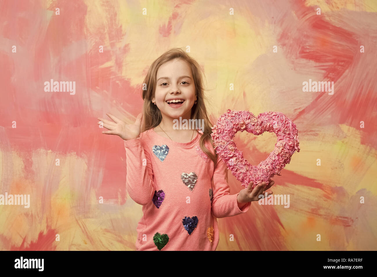 kid with decorative love heart. Child girl on colorful background ...