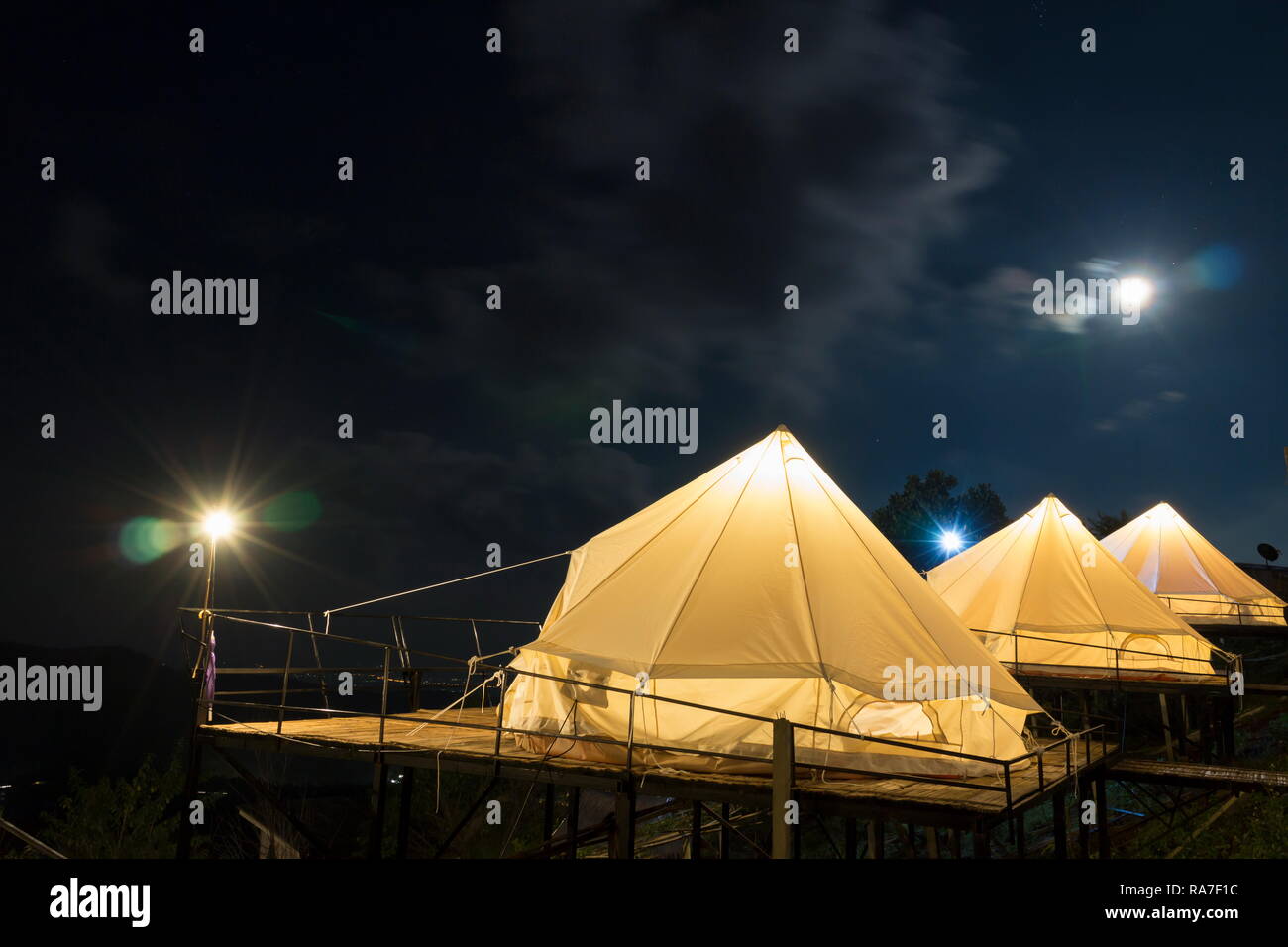 Camping tent under the moonlight and stars at night Stock Photo - Alamy