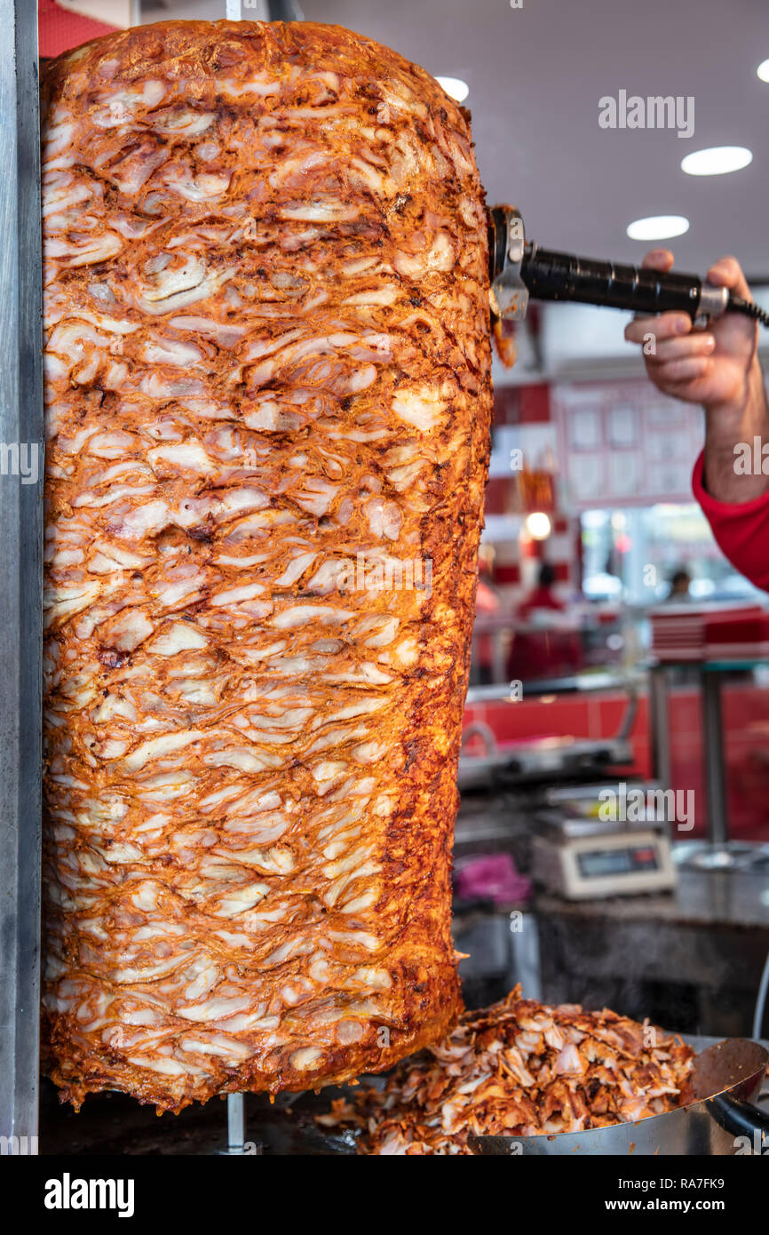 Delicious skewered fast food chicken doner shawarma meat cooking and ...