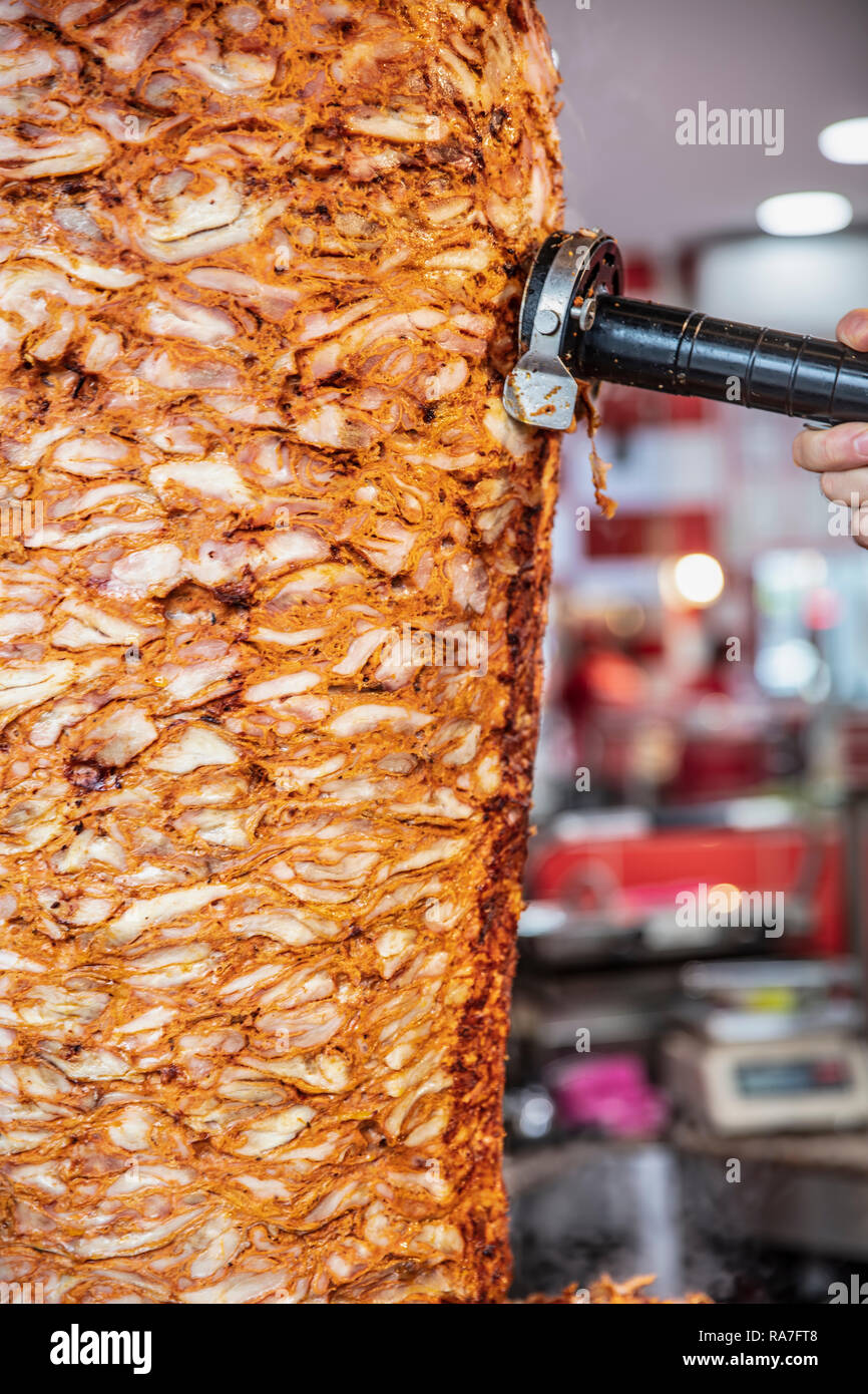 Delicious skewered fast food chicken doner shawarma meat cooking and ...