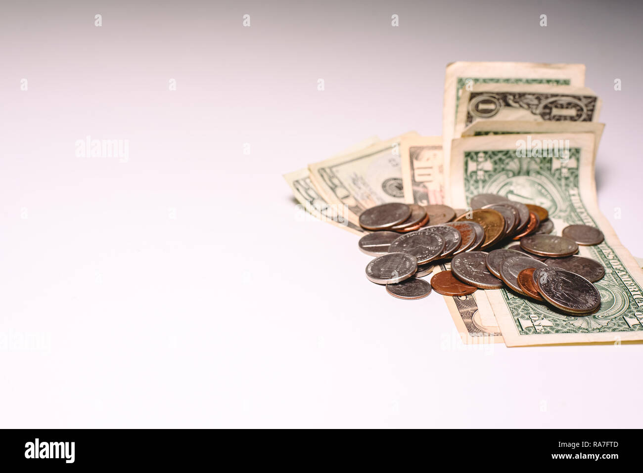 Coins and dollar bills isolated on white background with copy space ...