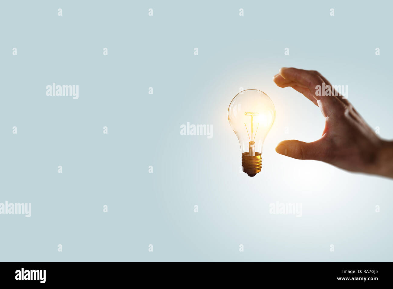 Glass bulb in hands Stock Photo - Alamy
