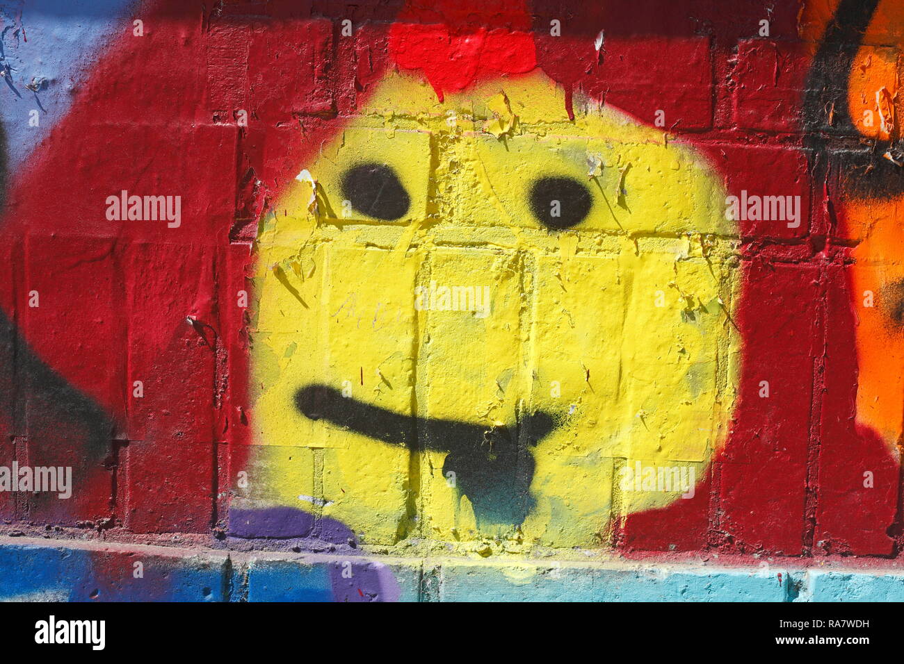 Yellow smiley, Colorful brick wall, Germany, Europe I Gelber smiley ...