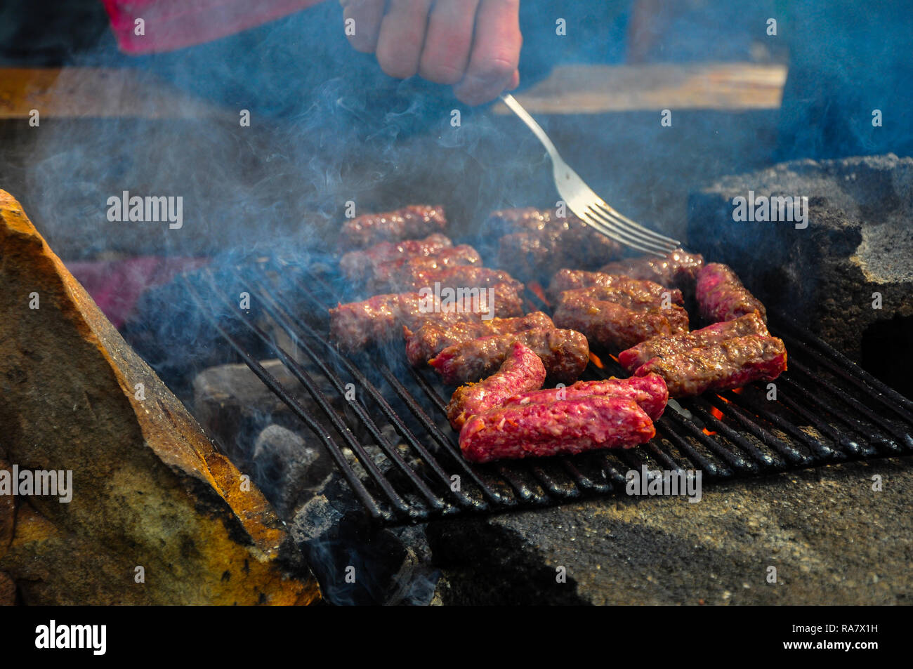 Bbq cevapi rostilj beef Bosnian food cooking on the grill Stock Photo ...