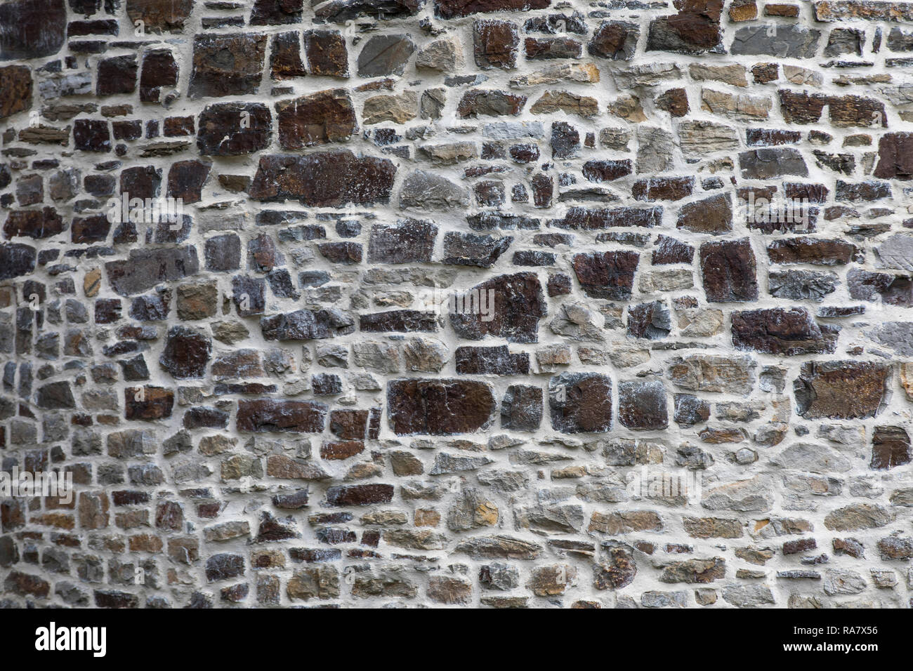 Brick wall made of rubble Stock Photo - Alamy