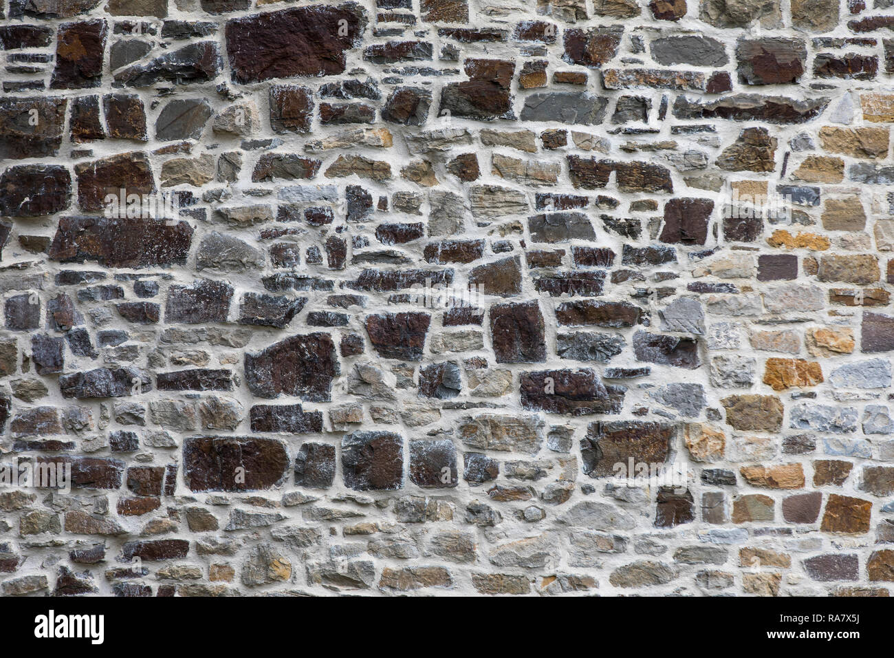 Brick wall made of rubble Stock Photo - Alamy