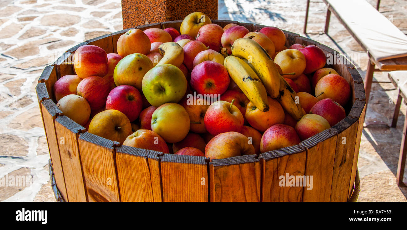 Differen kind of the fruits in the wooden barrel Stock Photo - Alamy
