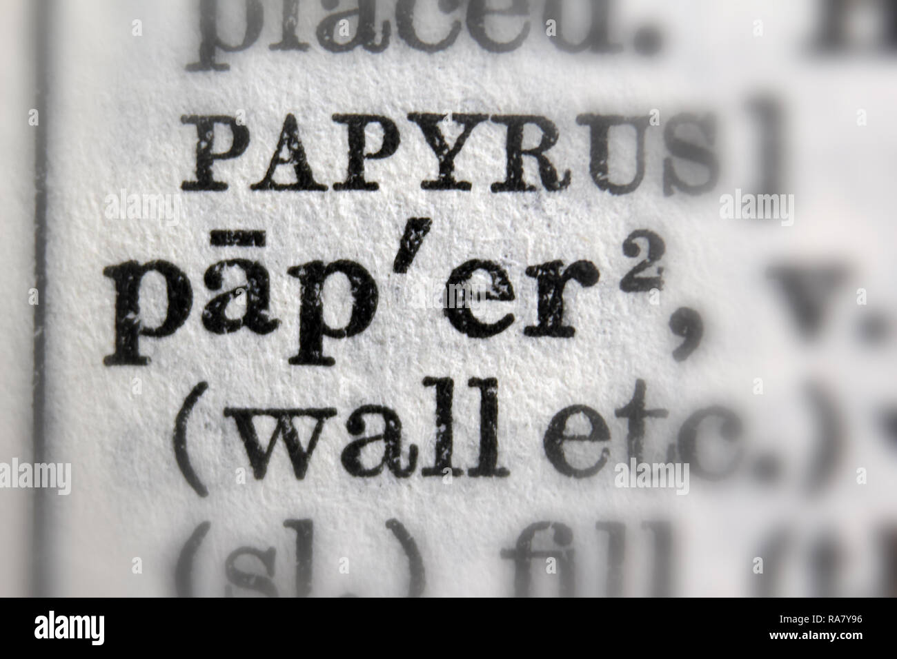 Paper and papyrus words bold on Oxford English Dictionary, close up ...