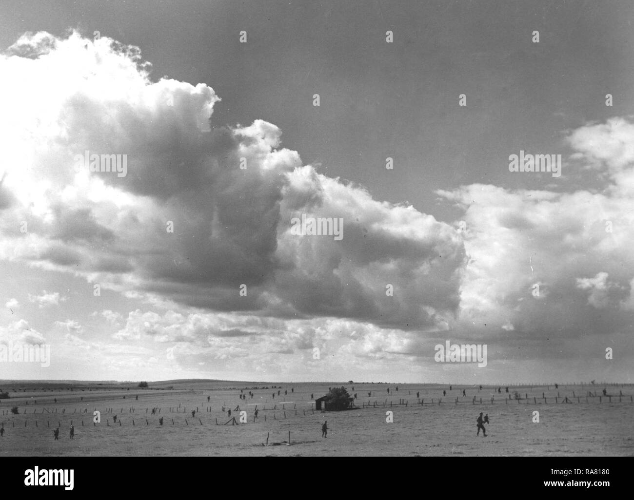 Original caption: U.S. Infantrymen push their way across flat Belgian ...