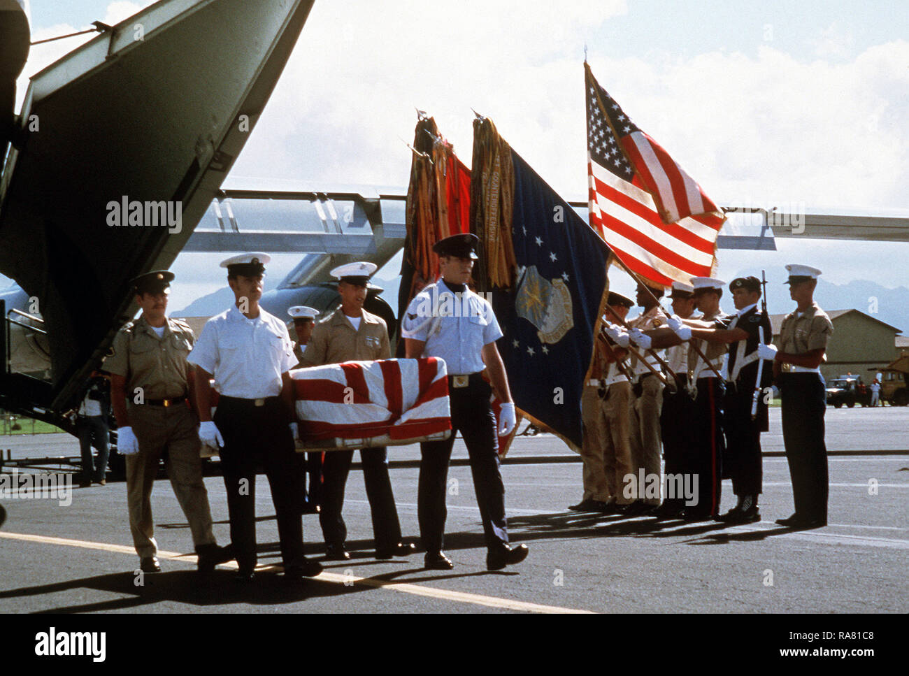 1978 - Joint-service pallbearers transfer flag-draped coffins of ...
