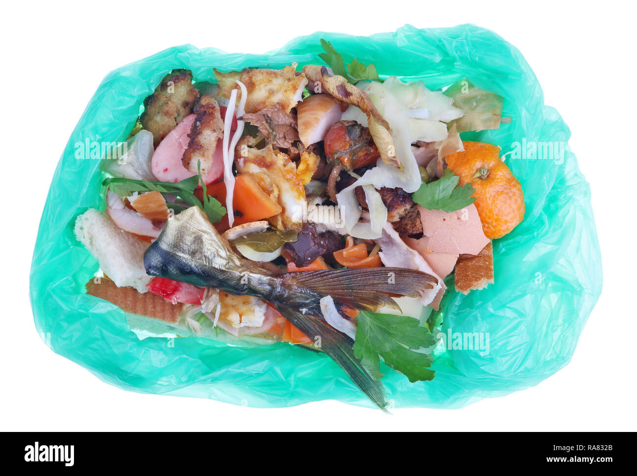 Food waste which remain after cooking in green plastic bag. Isolated ...