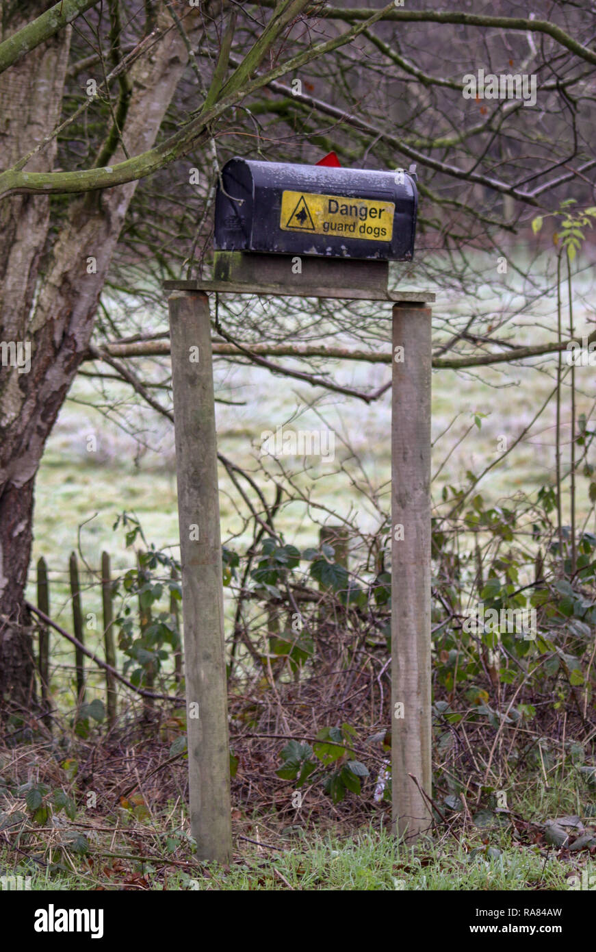 danger guard dog sign on post box Stock Photo - Alamy