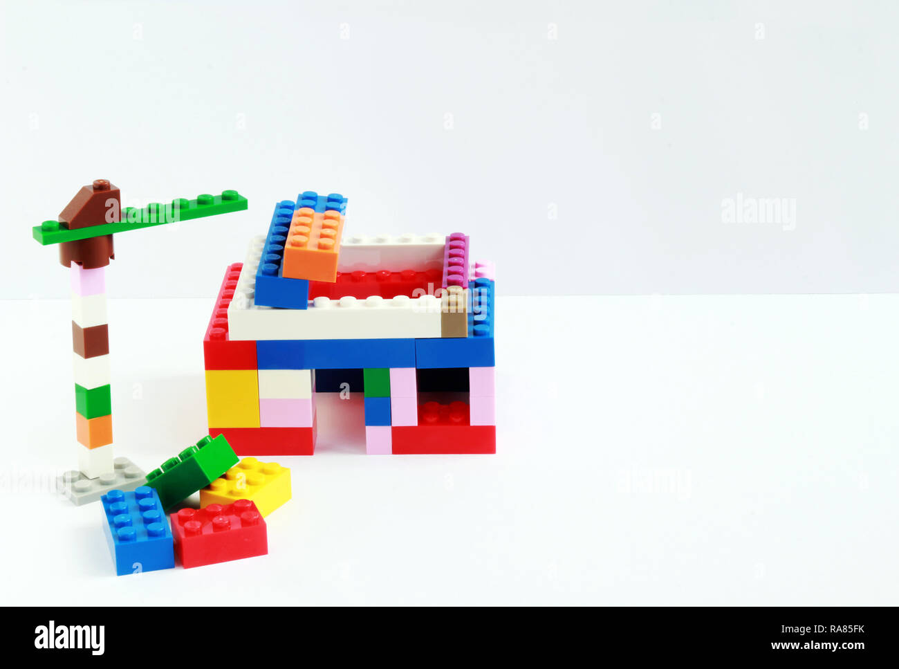 building a house with multi colored children blocks, in construction ...