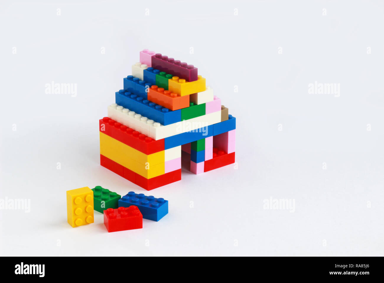 symbolic photo for building a house with multi colored building blocks ...