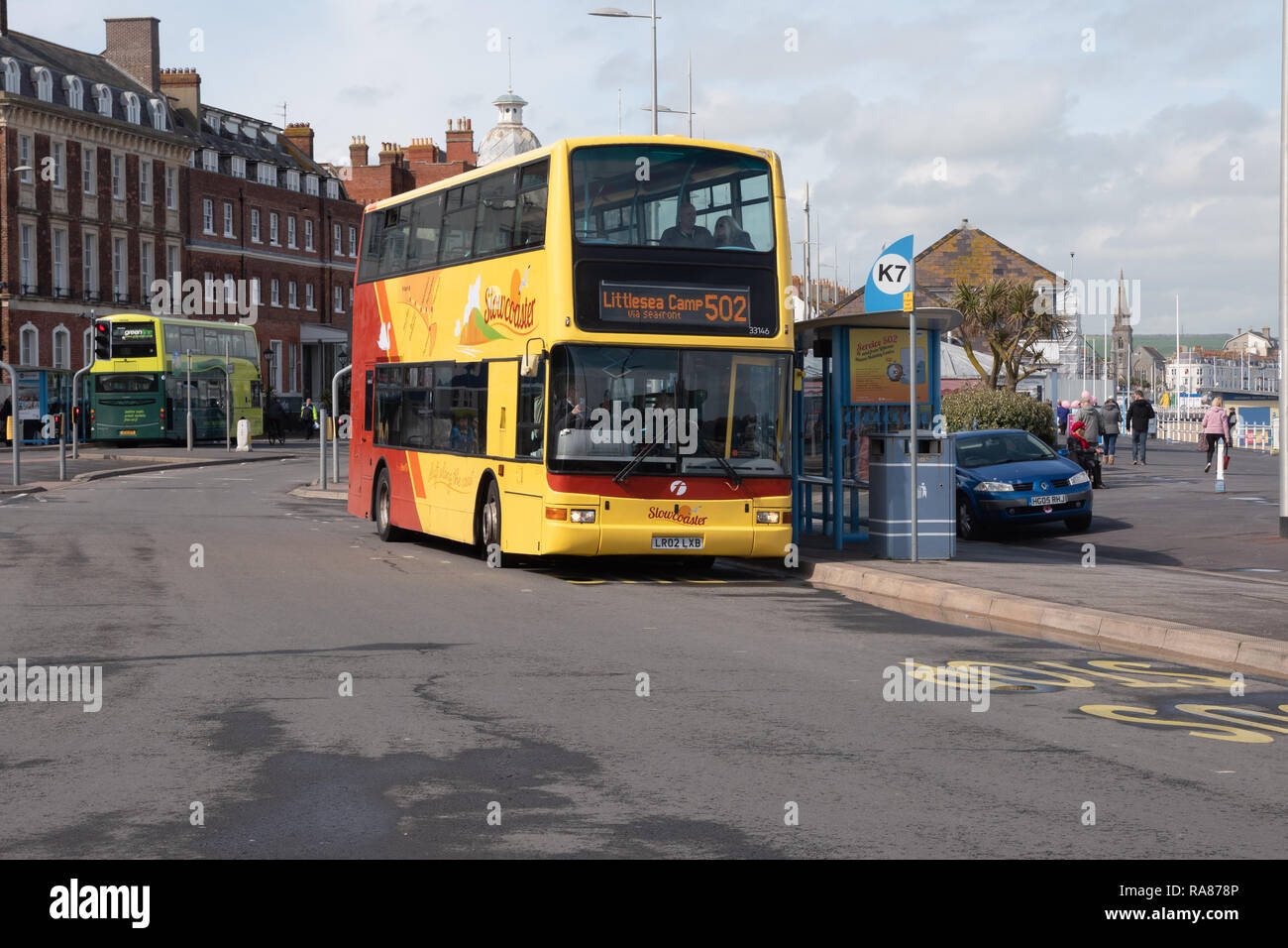Jurrasic Coaster Bus at Weymouth Kings Statue Stock Photo - Alamy