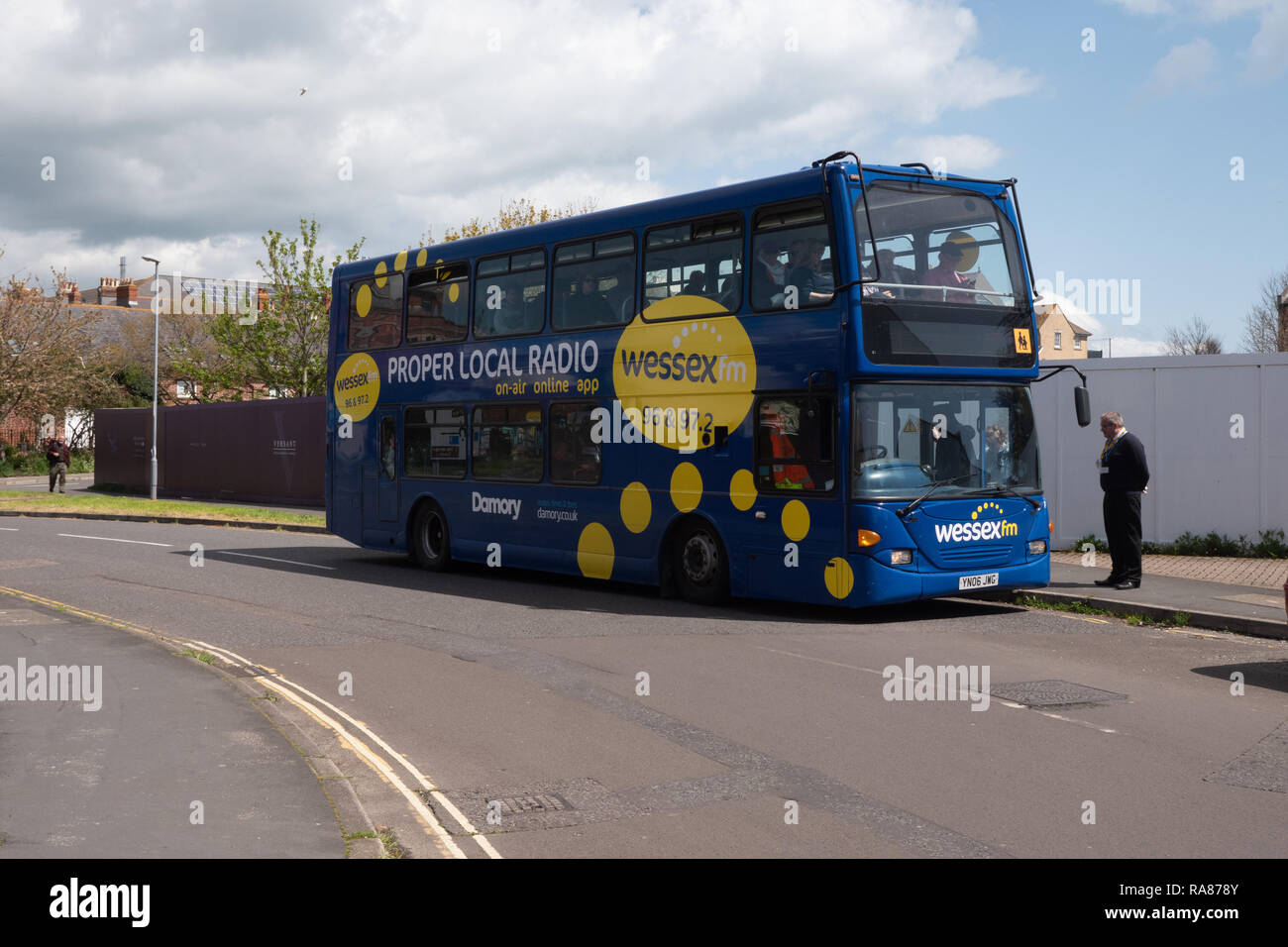 Damory bus in all over advertising livery for Wessex FM Stock Photo - Alamy