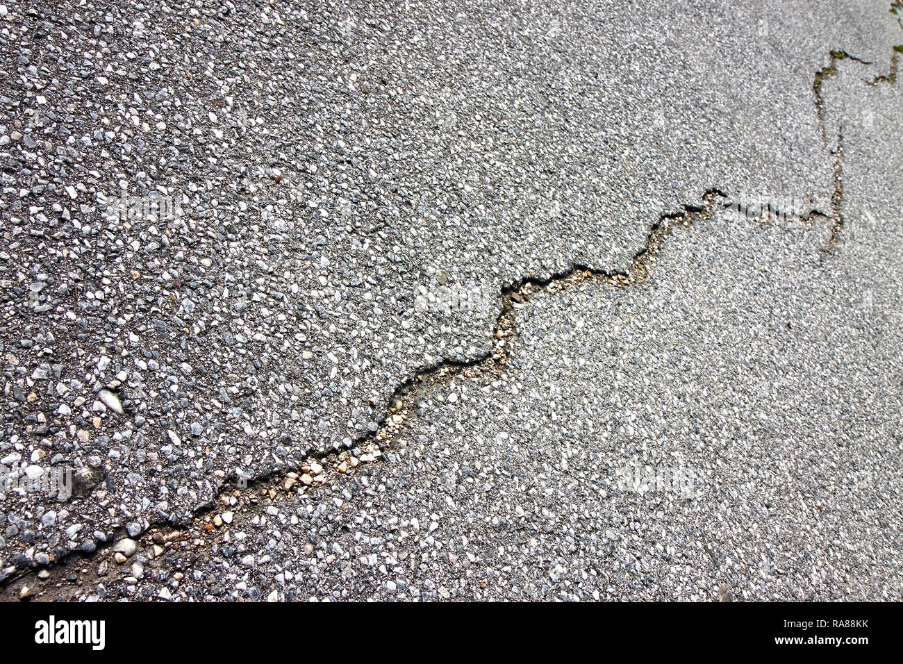 Asphalt road damaged after a structural failure Stock Photo - Alamy