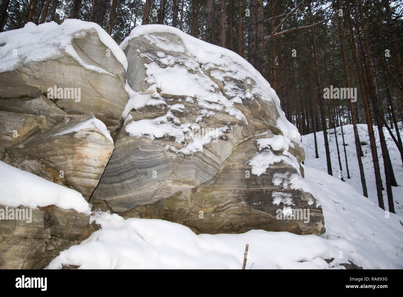 Marble rock in the forest under the snow, Russia, Ural Stock Photo - Alamy