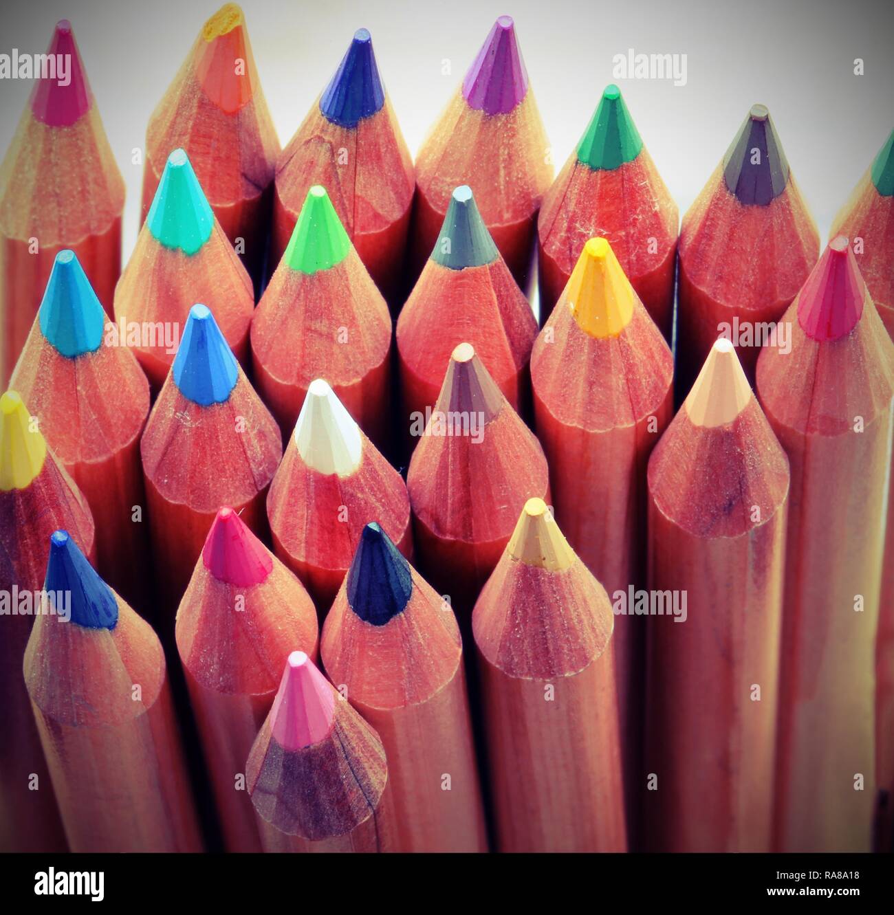 background with many colored pencils in the elementary school class ...