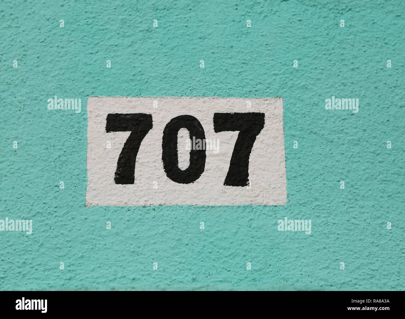 big text 707 in black ink on the wall of an house Stock Photo - Alamy