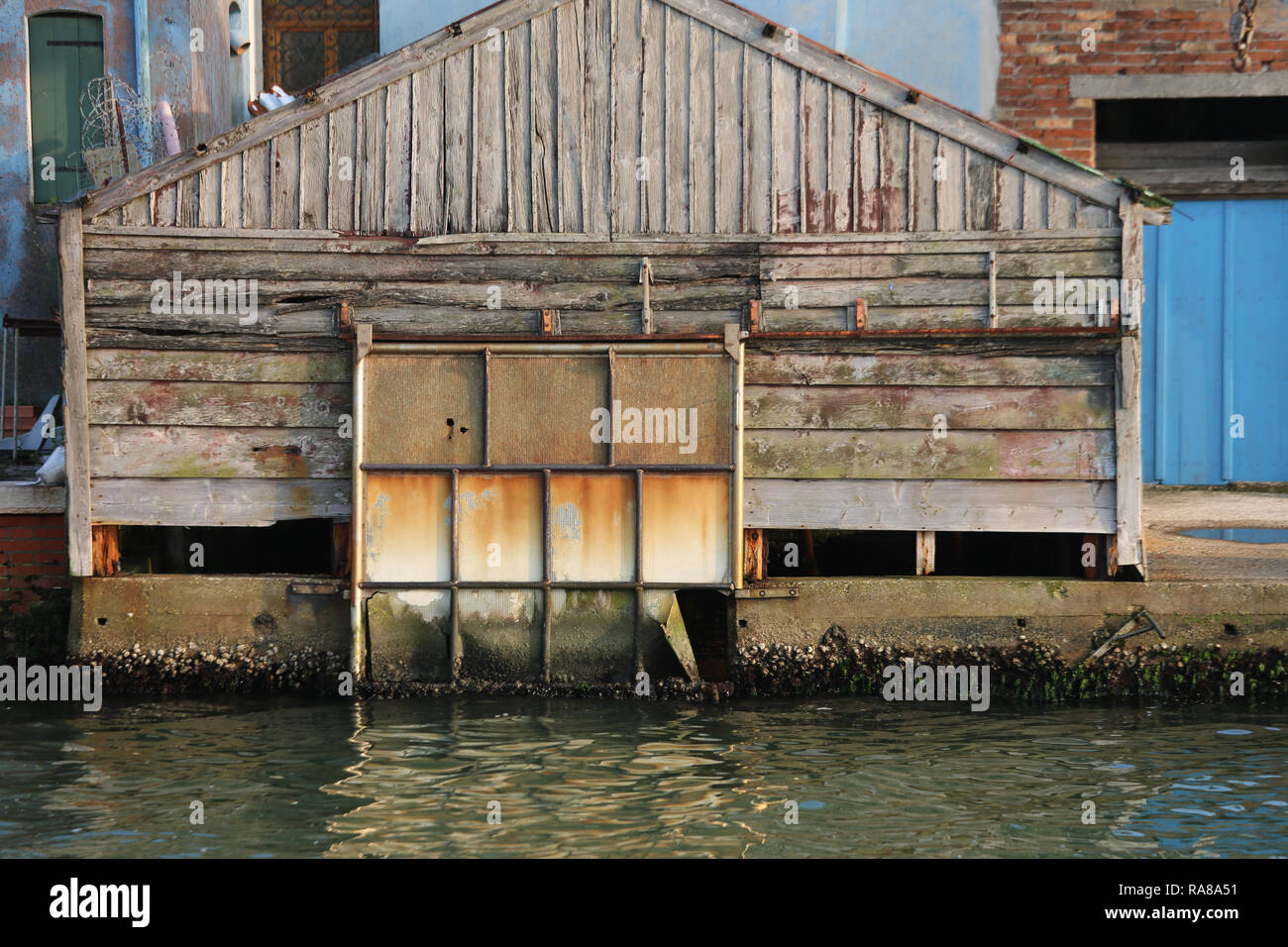 old rump used as a garage for boats on an island Stock Photo - Alamy