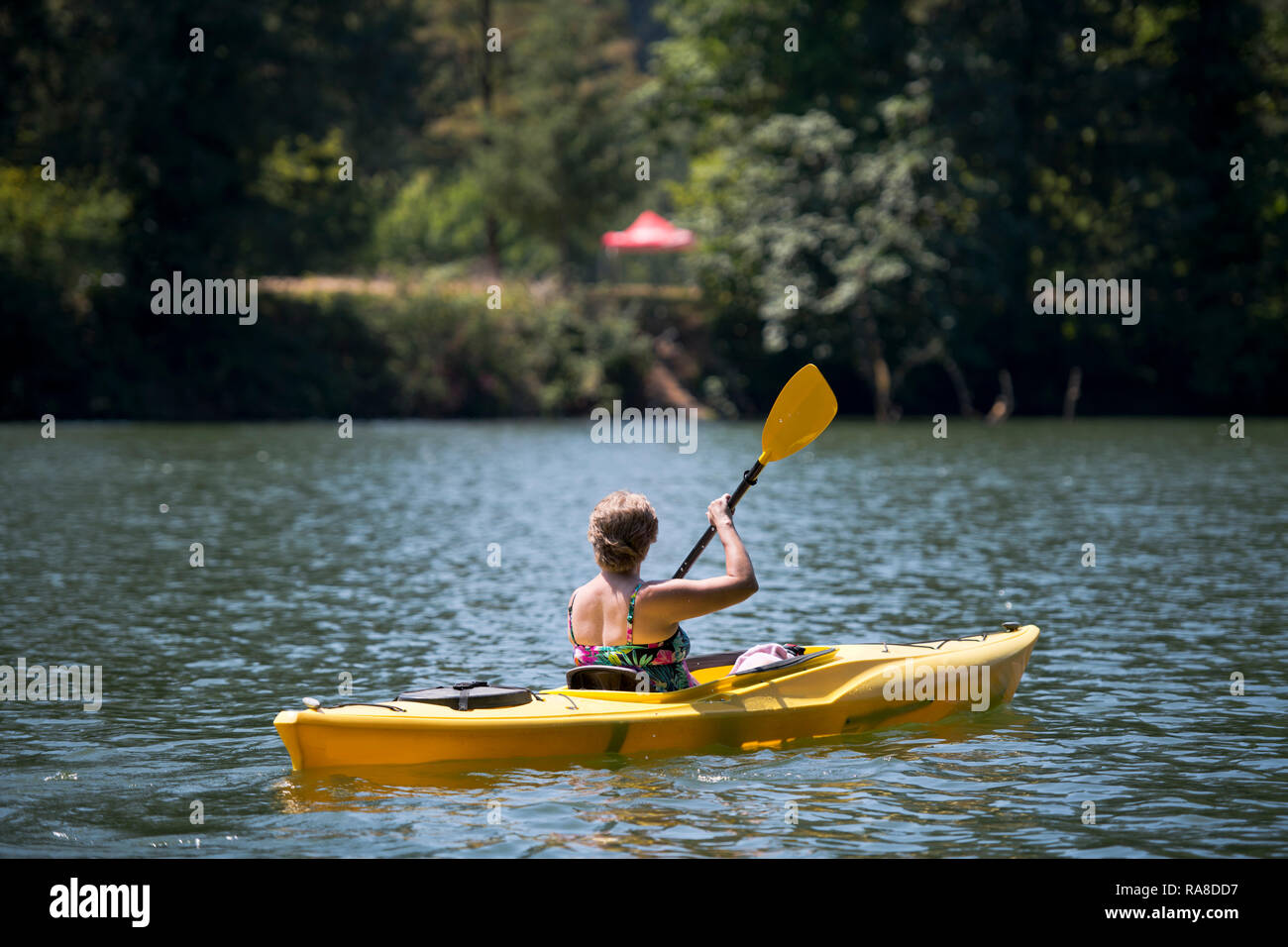 Woman in yellow kayak fishing hi-res stock photography and images - Alamy