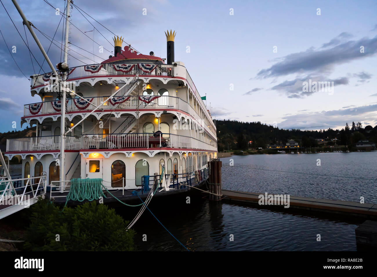 The old-fashioned multi-deck pleasure river cruise ship stands at the ...