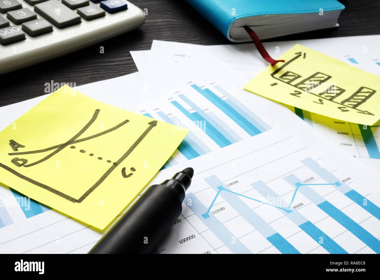 Business market analysis. Financial documents and charts in the office ...