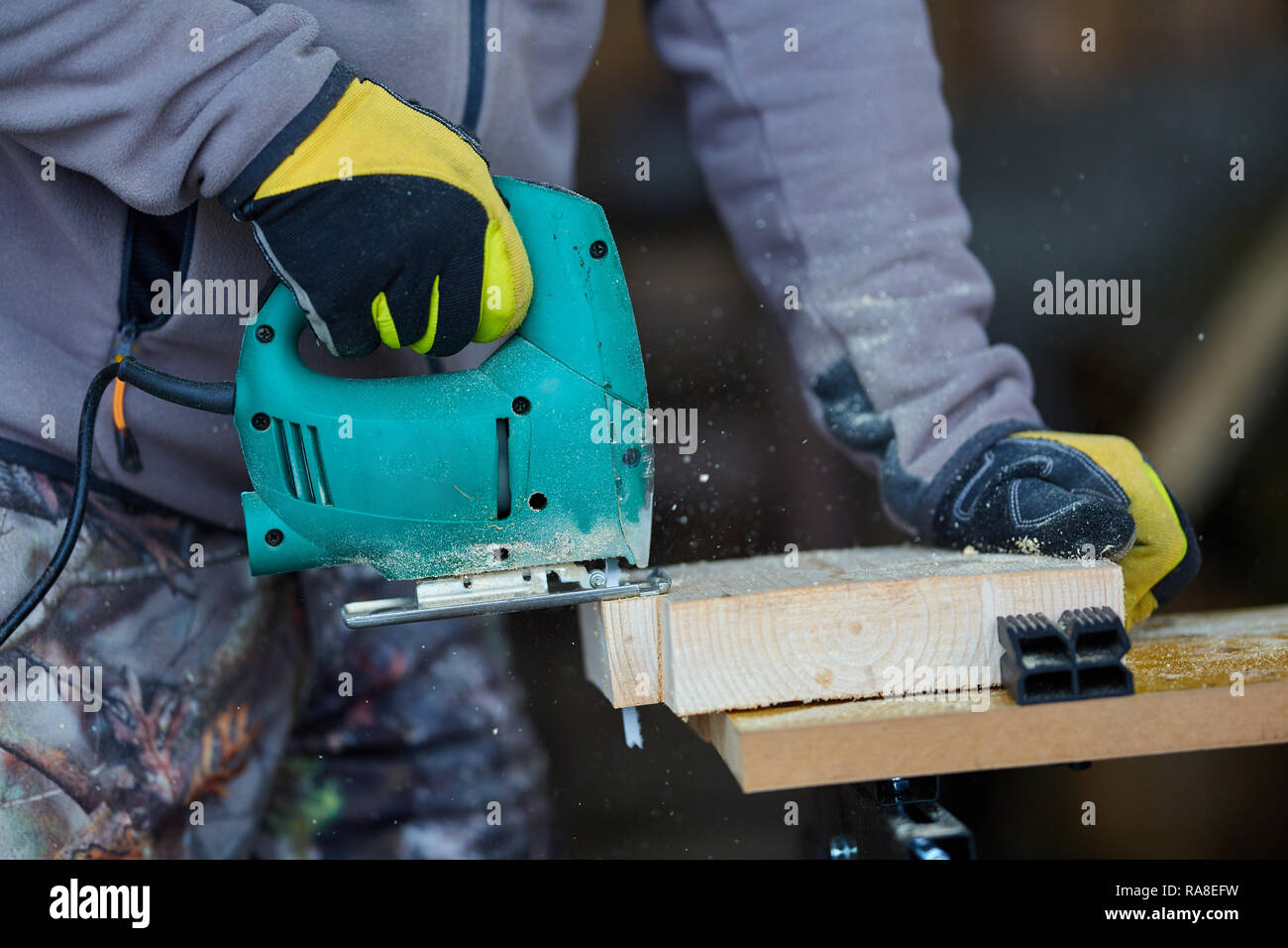 Cutting material using jigsaw hi-res stock photography and images - Alamy