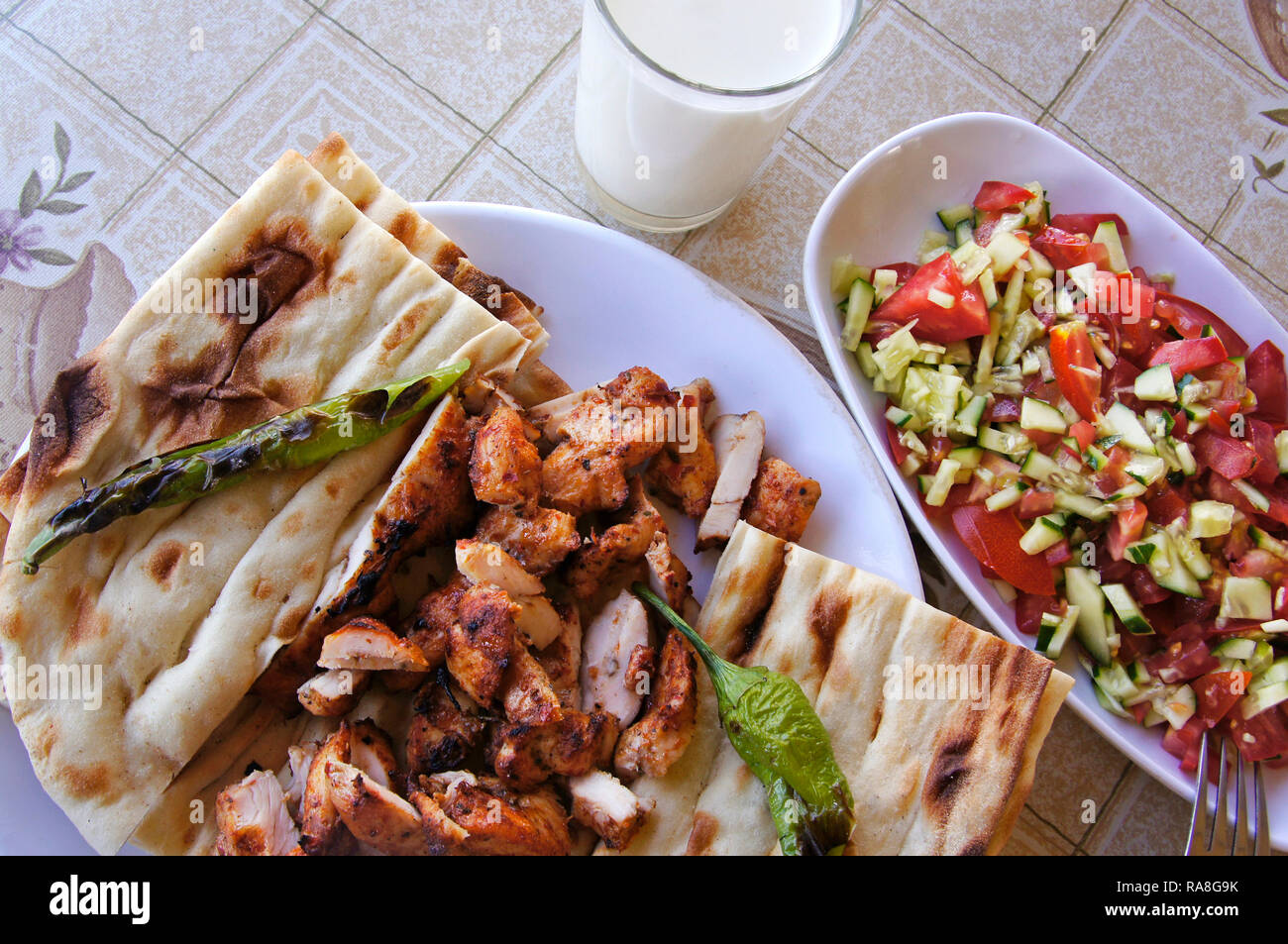 Traditional Turkish Food. Chicken Kebab, Tomatoes and Cucumber salad ...