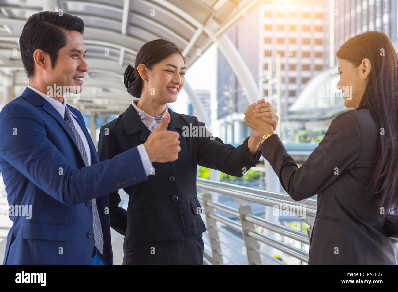 Teamwork of Asian business peoples Stock Photo - Alamy