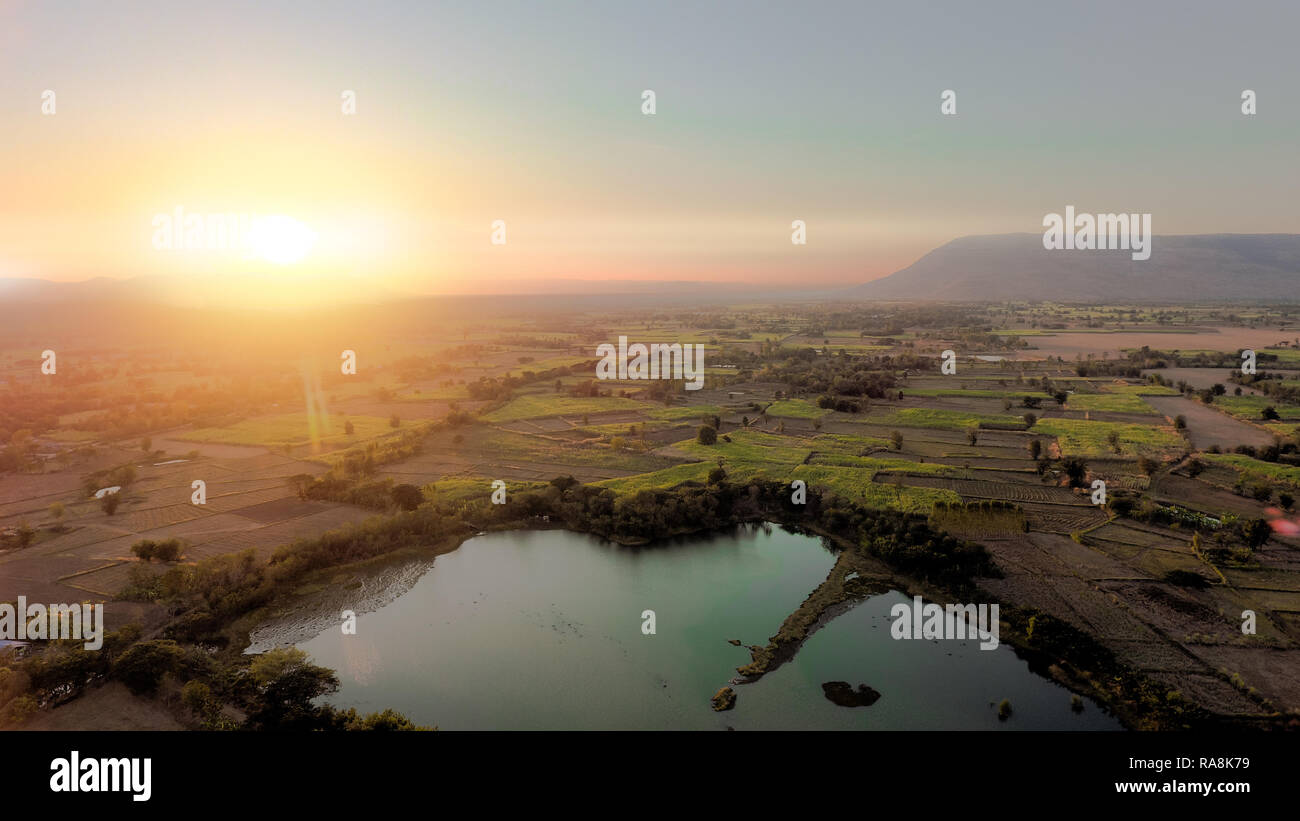 top view small lake with sunset light, landscape of small lake and ...