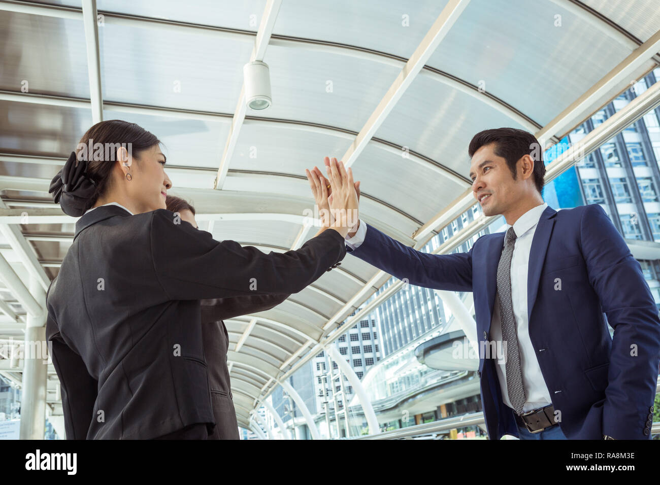 Teamwork of Asian business peoples Stock Photo - Alamy